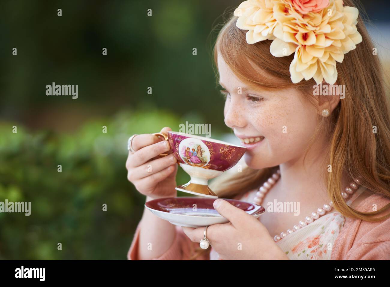 This tea party is really fun. A cute little girl having a tea party ...