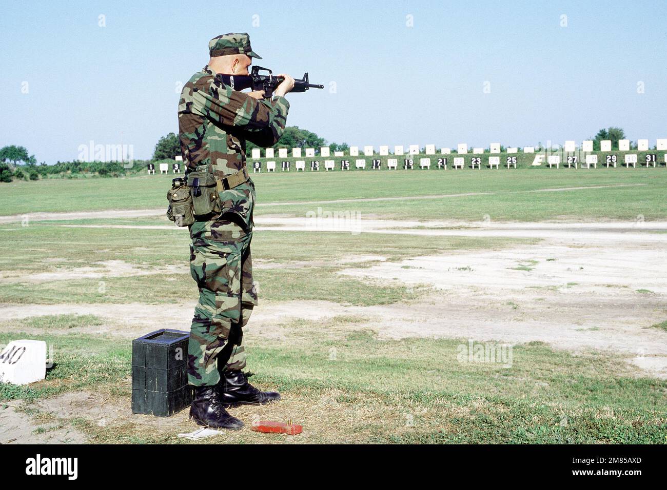 A Marine recruit fires an M-16A2 rifle during small arms qualifications ...