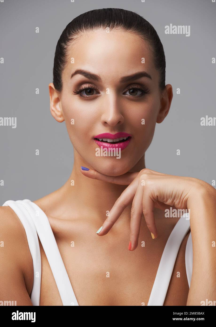 Using color to express herself. Studio shot of an attractive young ...