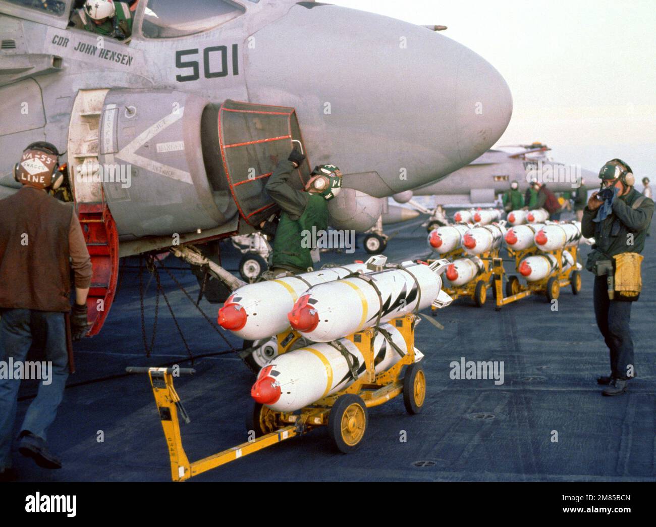 Flight deck crewmen from Attack Squadron 55 (VA-55) prepare an A-6E ...