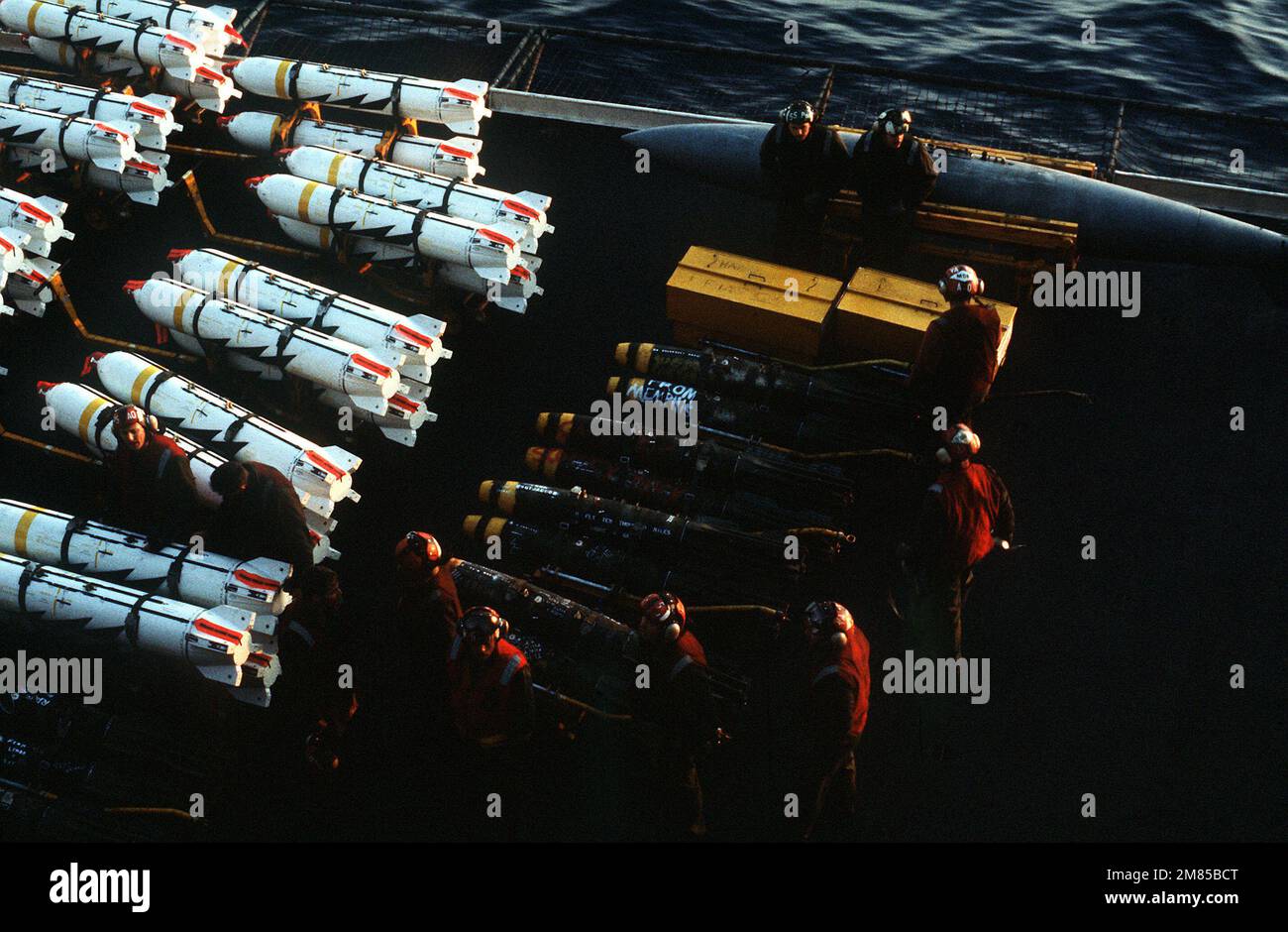 Aviation ordnancemen stage Mark 82 500-lb. bombs and CBU-59 cluster ...
