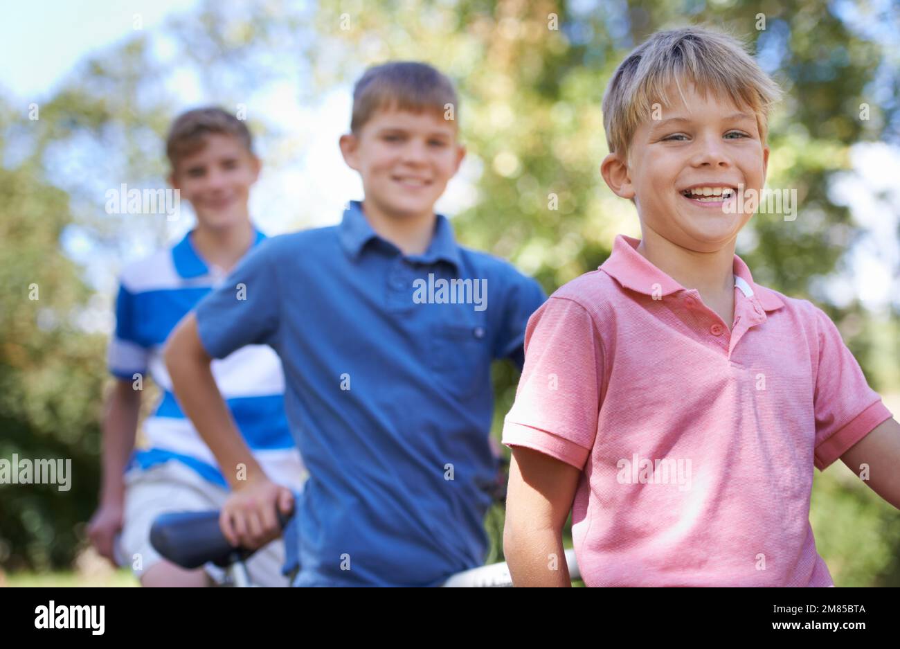 Out for an awesome bike ride. Three brothers out for a bike ride in the ...