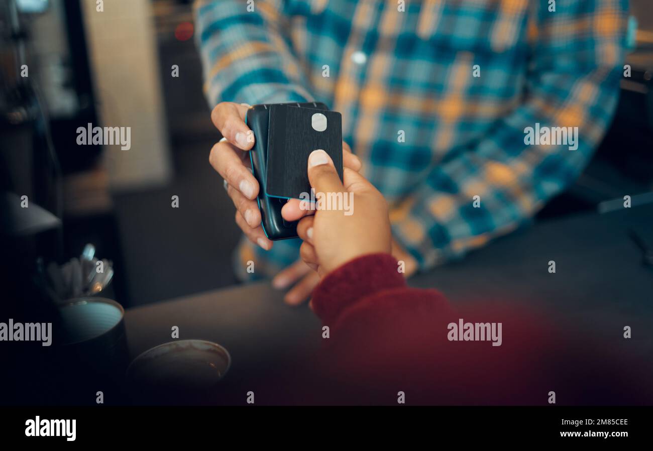 Credit card, pos payment and hands of man, store cashier or cafe waiter ...