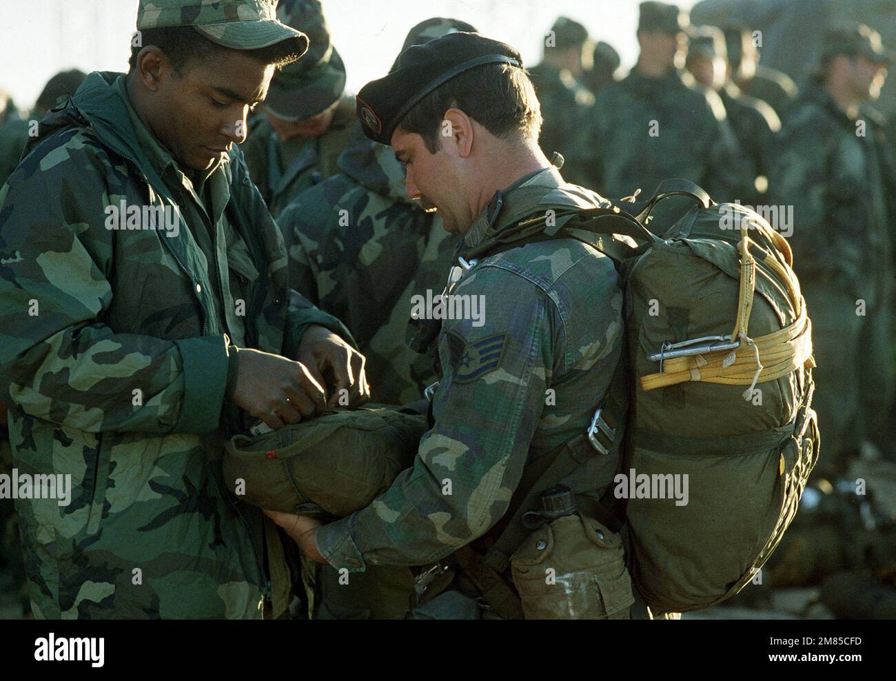 U.S. and Bolivian soldiers perform final safety checks on their ...