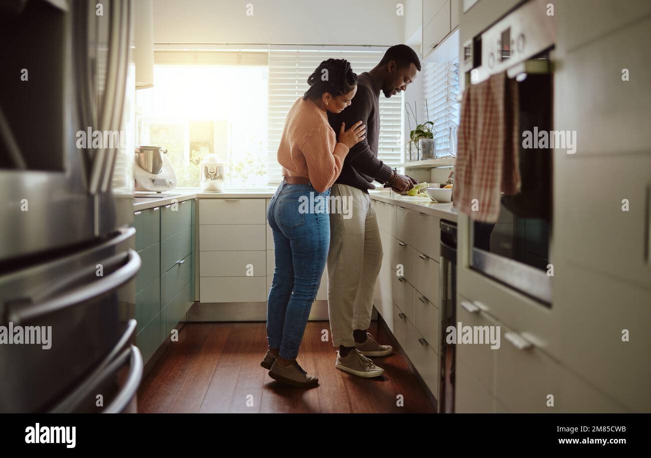 Black woman cooking in kitchen hi-res stock photography and images - Alamy