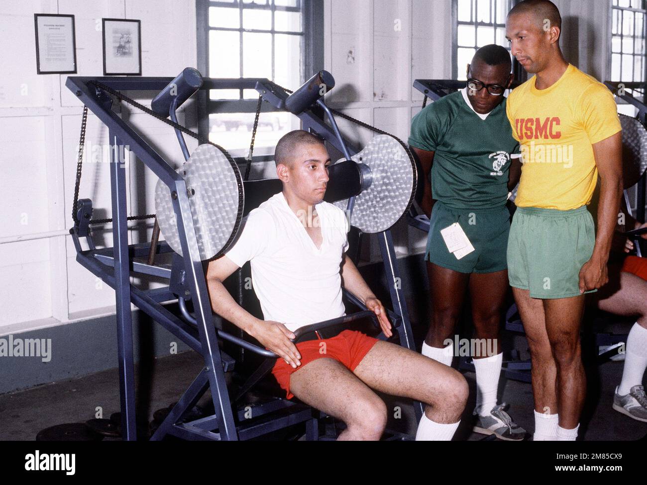 A Marine recruit of the physical conditioning platoon exercises with a ...