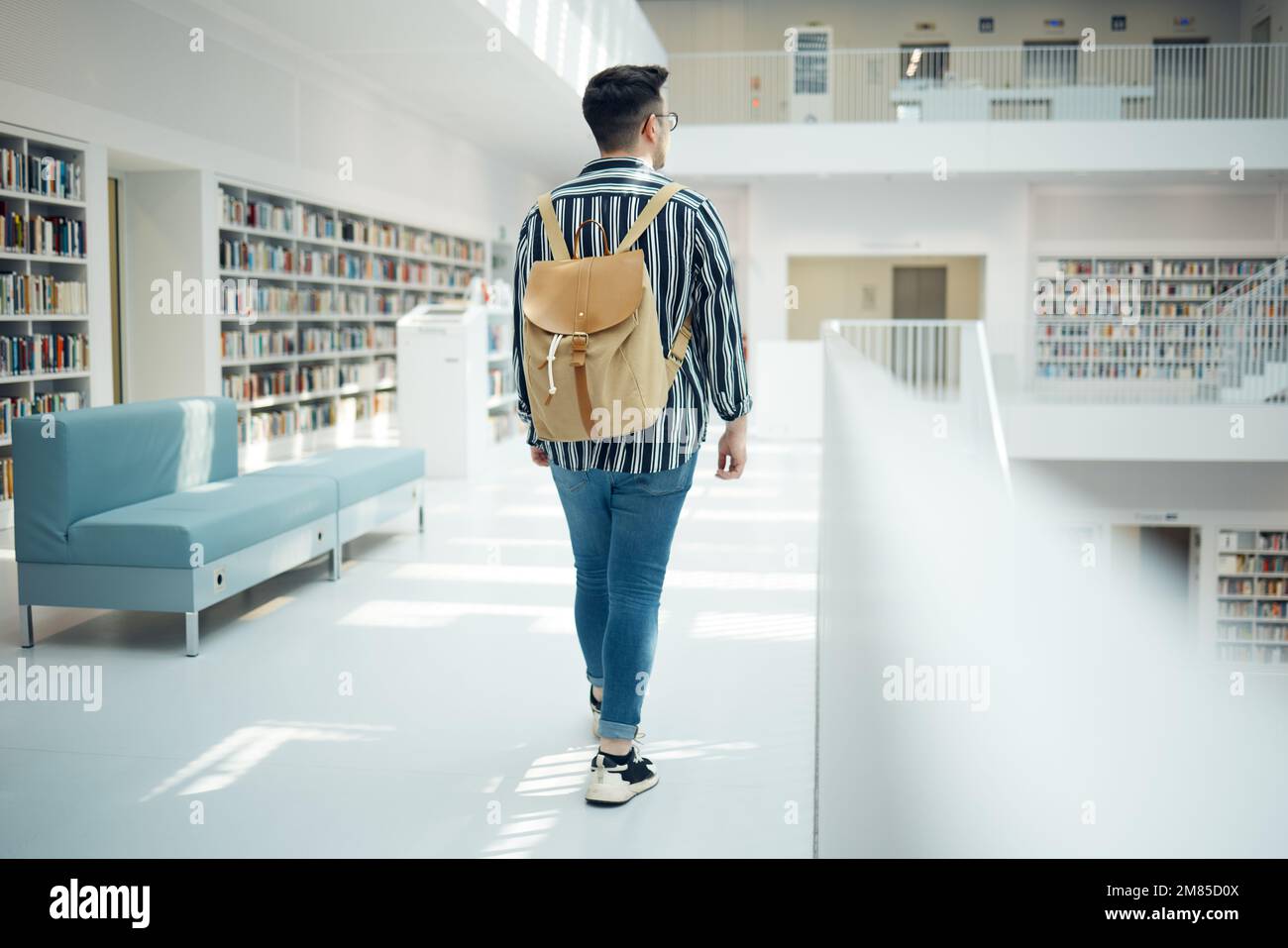 Man reading a book while walking hi-res stock photography and images ...