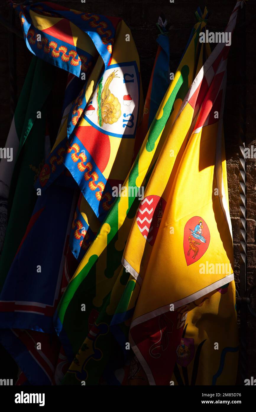 SIENA, ITALY ON AUGUST 27, 2014.Colorful banners of the Contrade, flags ...