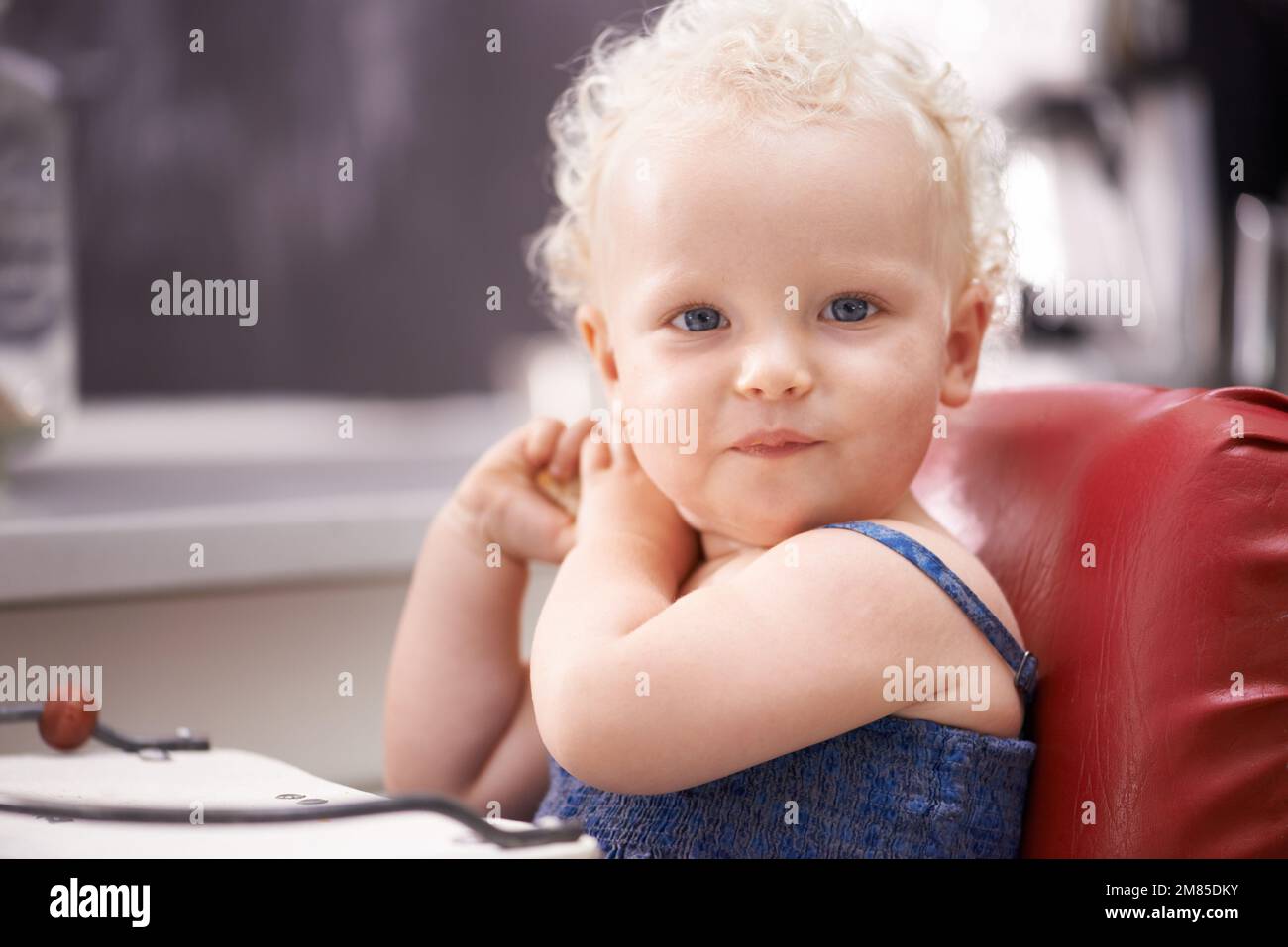 This muffins mine. A little girl enjoying a muffin in her feeding chair ...