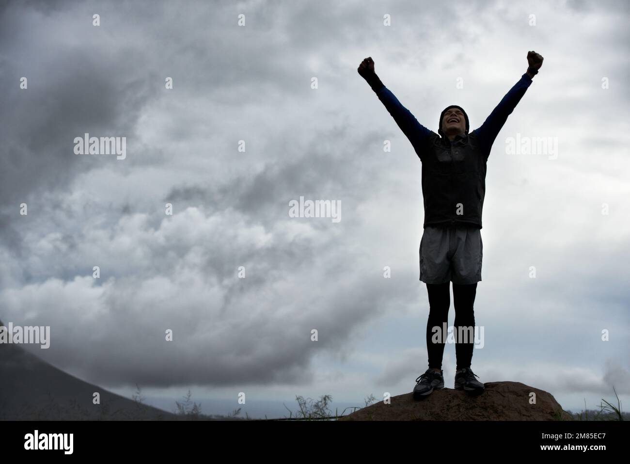 Man climbing hill hi-res stock photography and images - Alamy