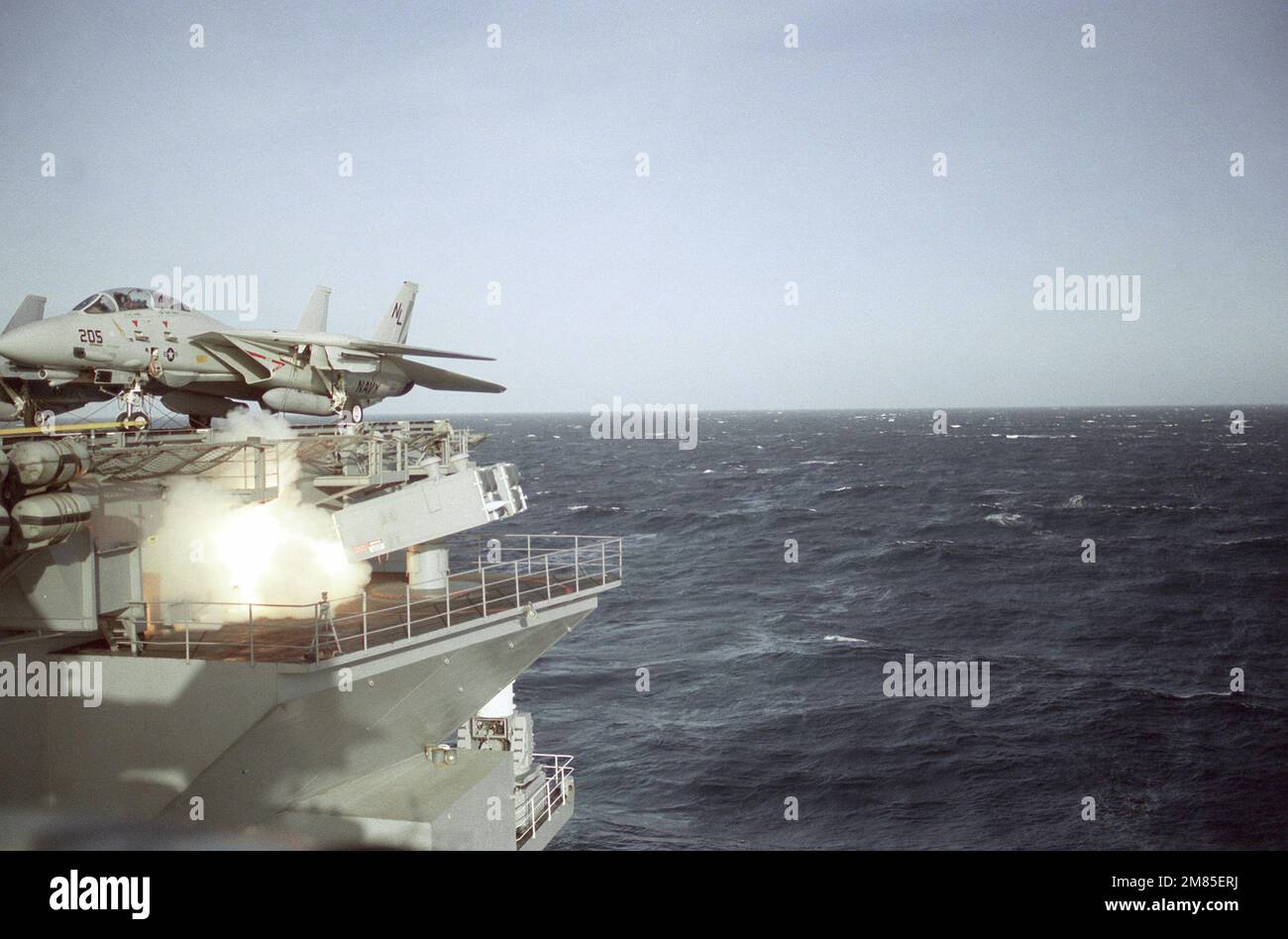 A RIM-7 Sea Sparrow missile is launched from a Mark 29 box launcher ...