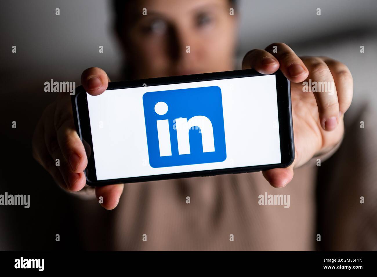 In this photo illustration a LinkedIn logo is seen displayed on a ...