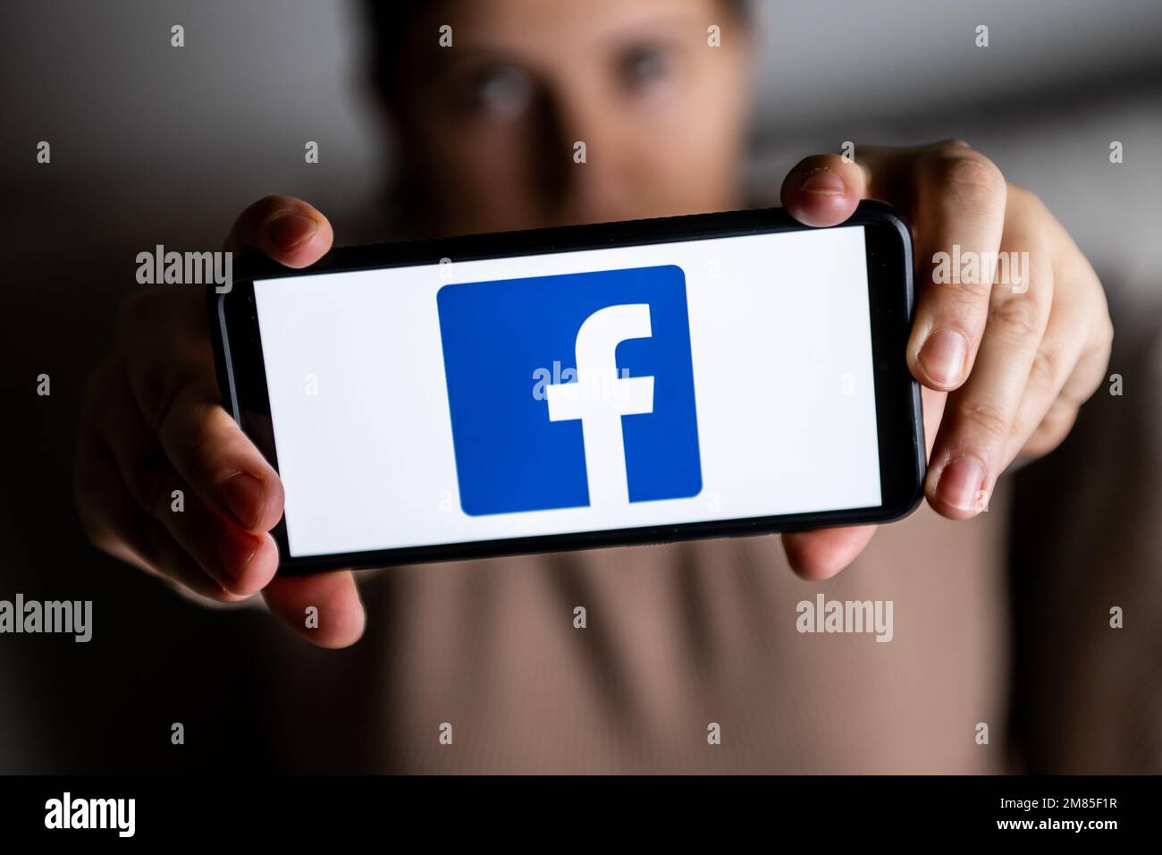 In this photo illustration a Facebook logo is seen displayed on a ...