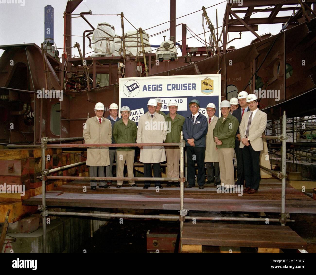 Officials attend the kneel laying of the guided missile cruiser CG-58 ...