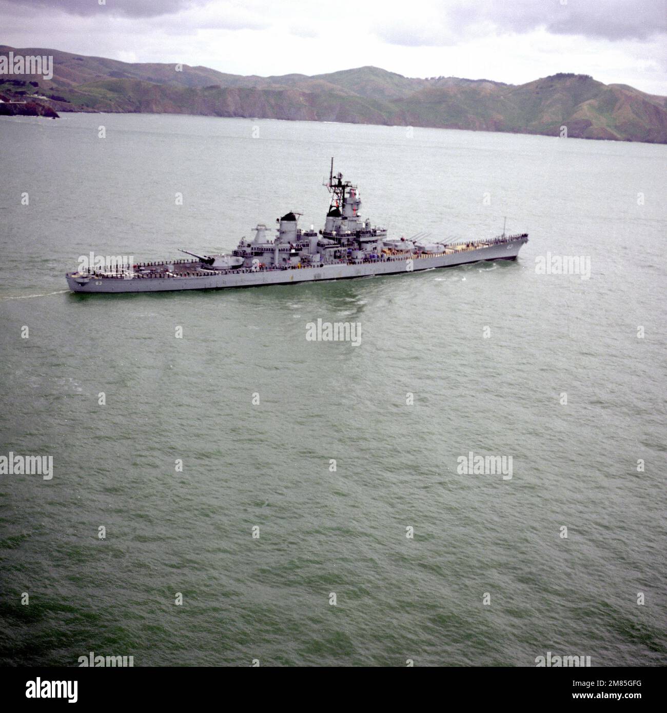 An elevated starboard view of the battleship USS MISSOURI (BB-63) en ...