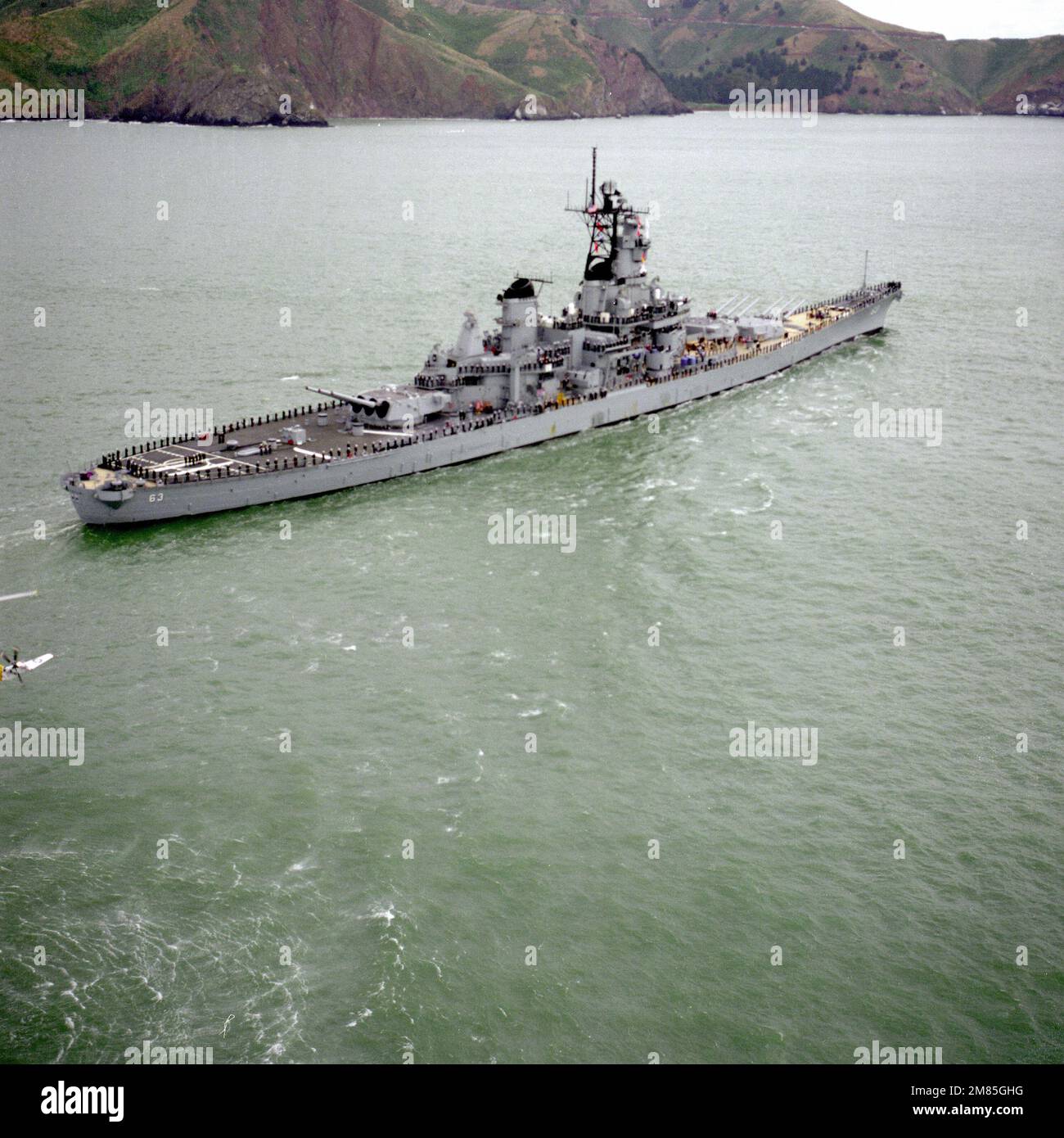 An elevated starboard quarter view of the battleship USS MISSOURI (BB ...