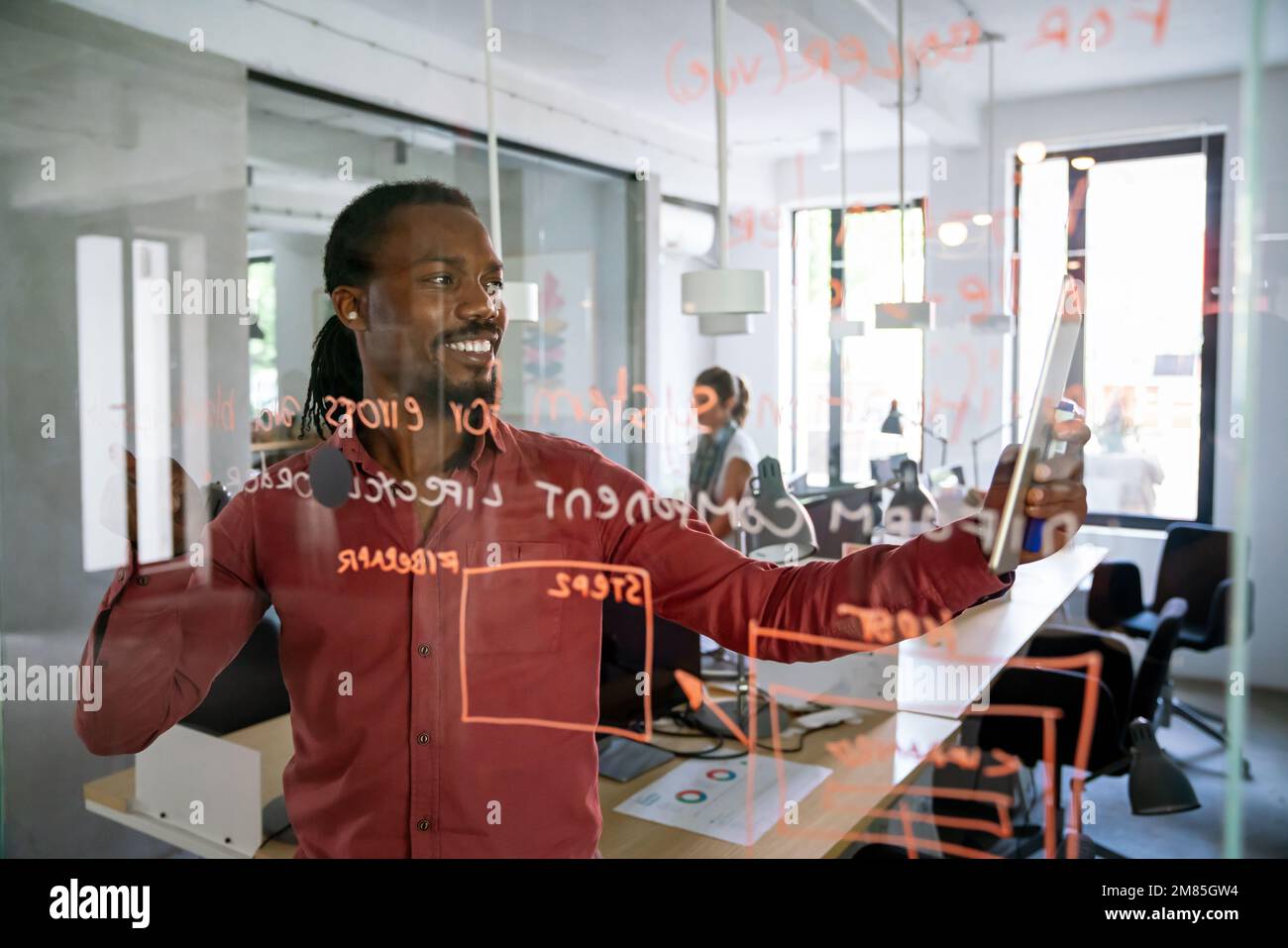 Business man making notes of information during workflow planning ...