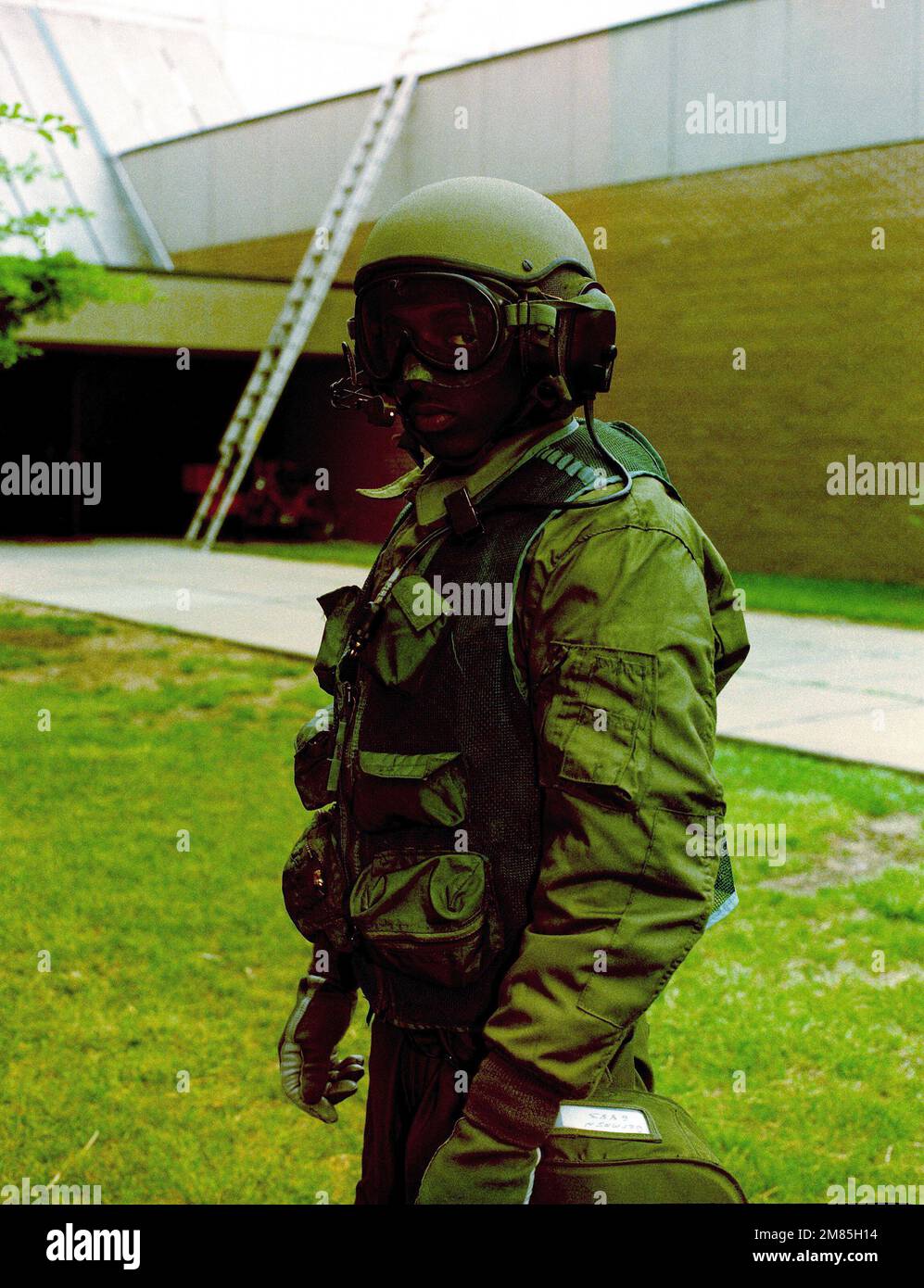 A member of an armored unit models his helmet and uniform at Skidgel ...