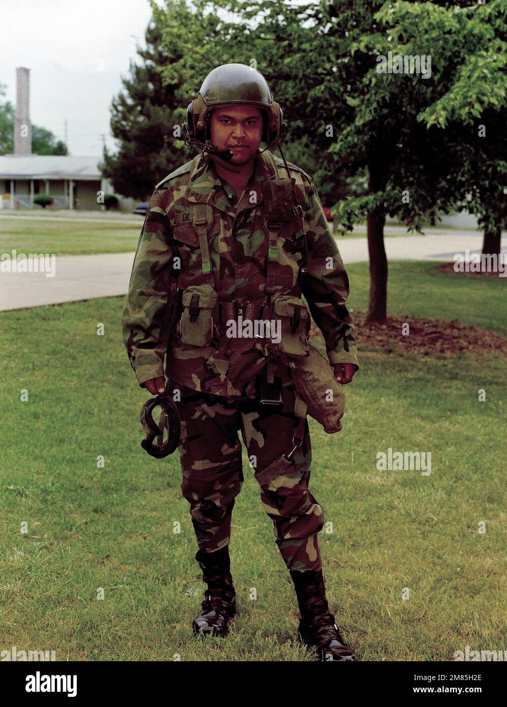 A member of an armored unit models his helmet and uniform at Skidgel ...