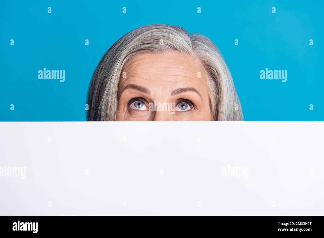 Portrait of aged person half face peeking look interested up empty ...
