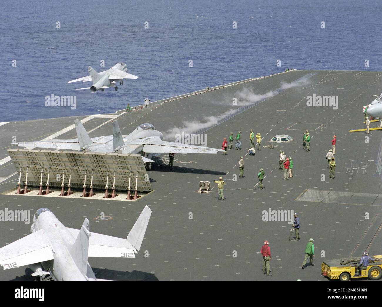 Flight deck crewmen prepare to launch a Fighter Squadron 51 (VF-51) F ...