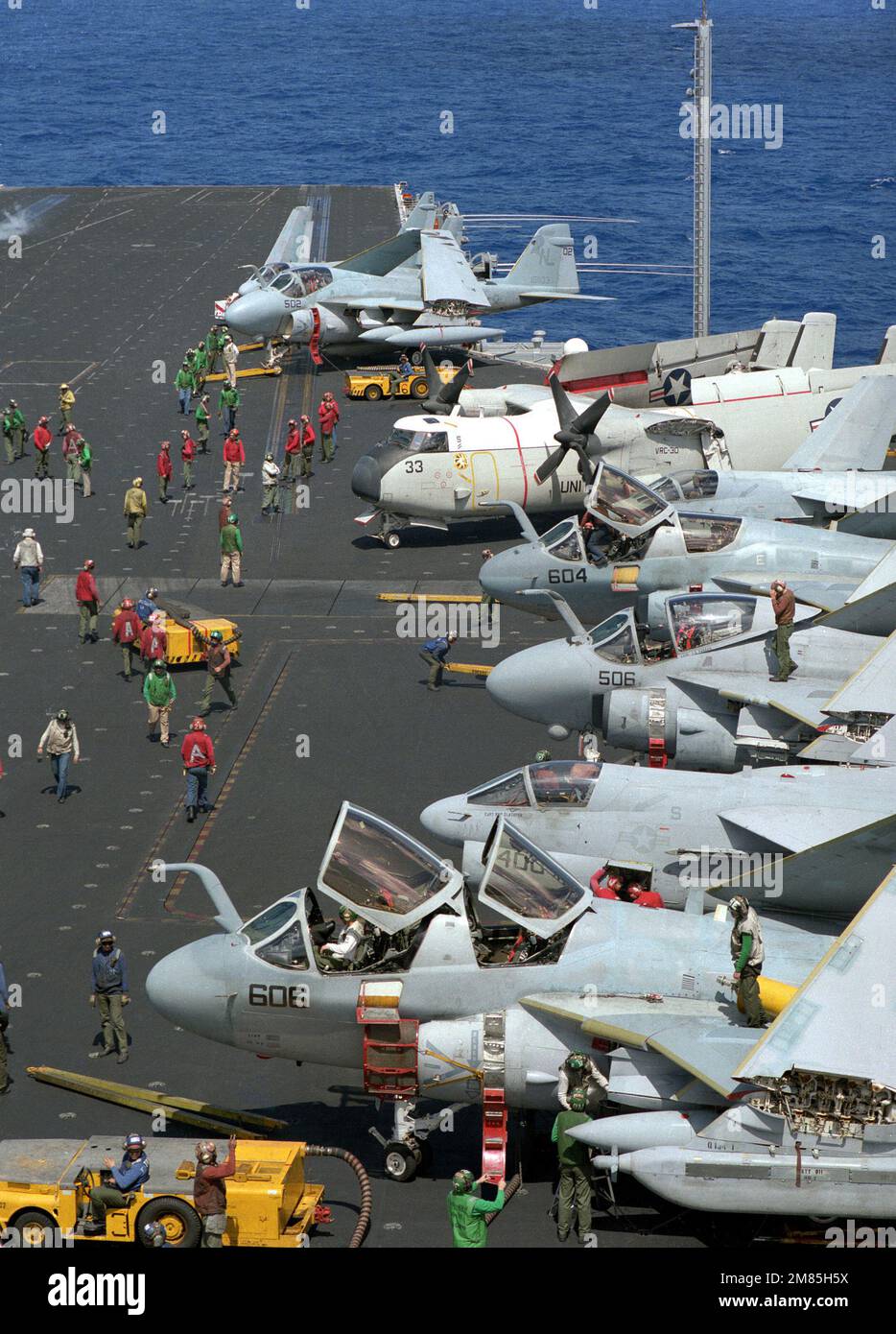 Flight deck crewmen prepare various aircraft for flight aboard the ...