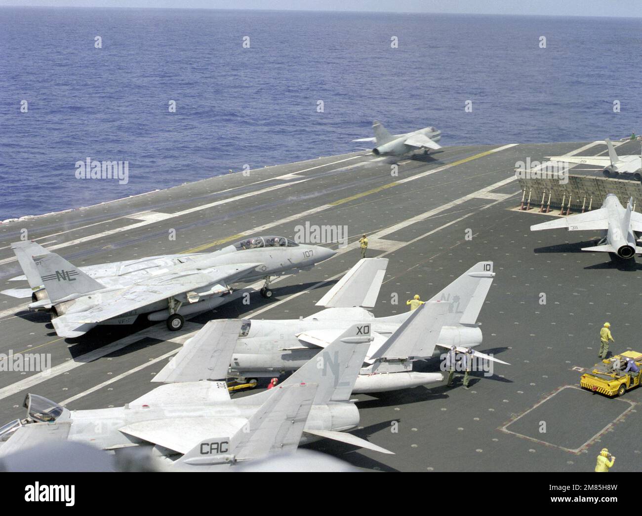 A Fighter Squadron 51 (VF-51) F-14A Tomcat aircraft waits in line for a ...