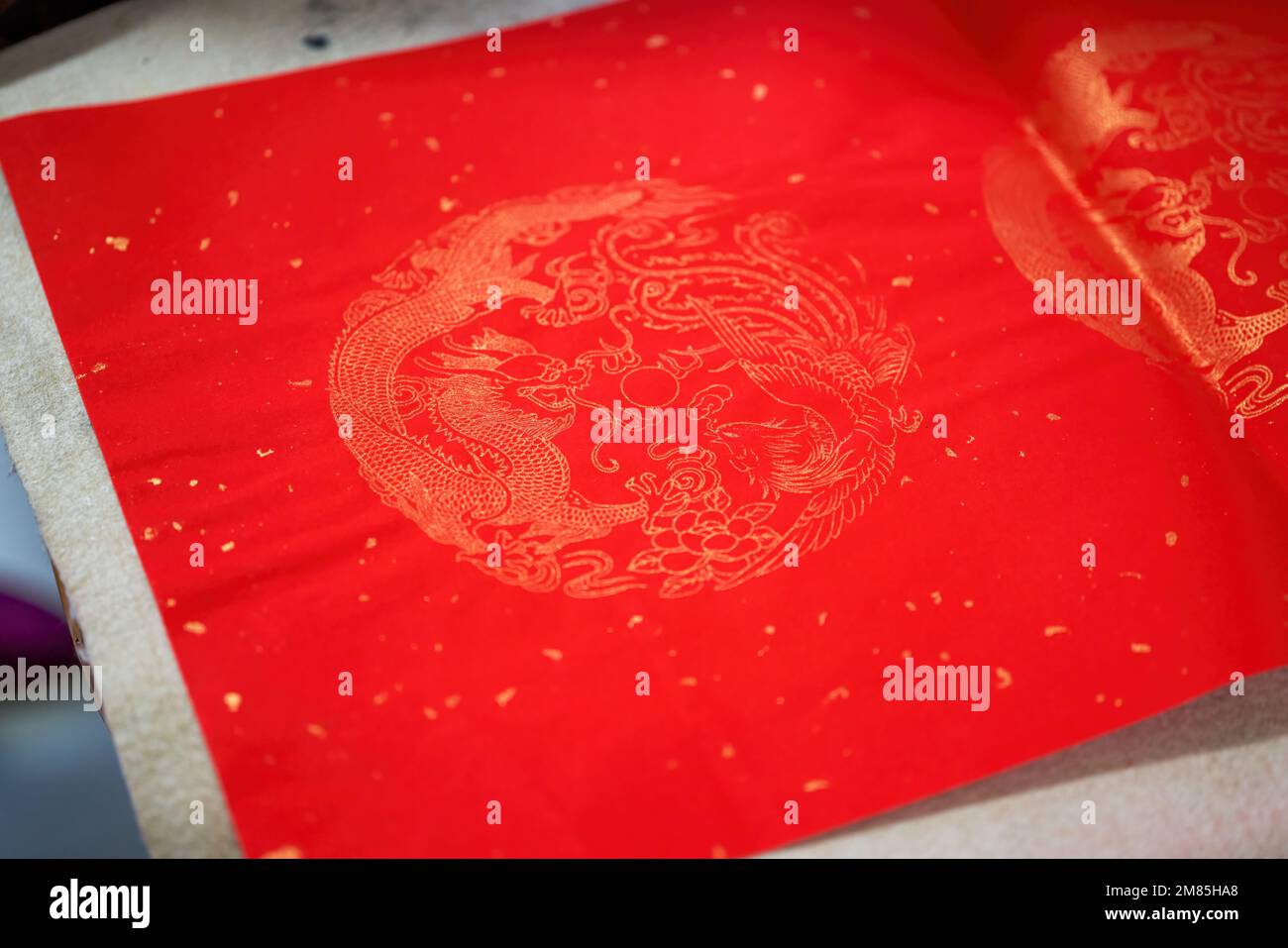 Closeup of a piece of red paper used to write Chinese New Year couplets ...