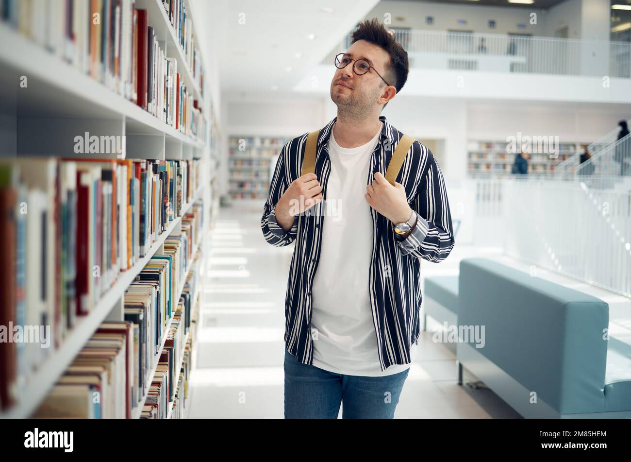 Library bookshelf, student and search for university, college or school ...