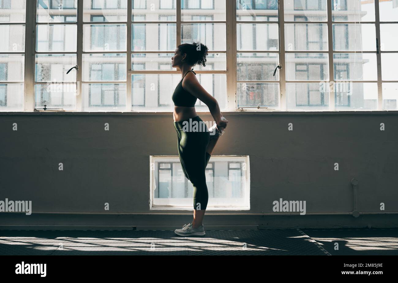 Exercise, stretching and a woman at gym for fitness workout for health ...