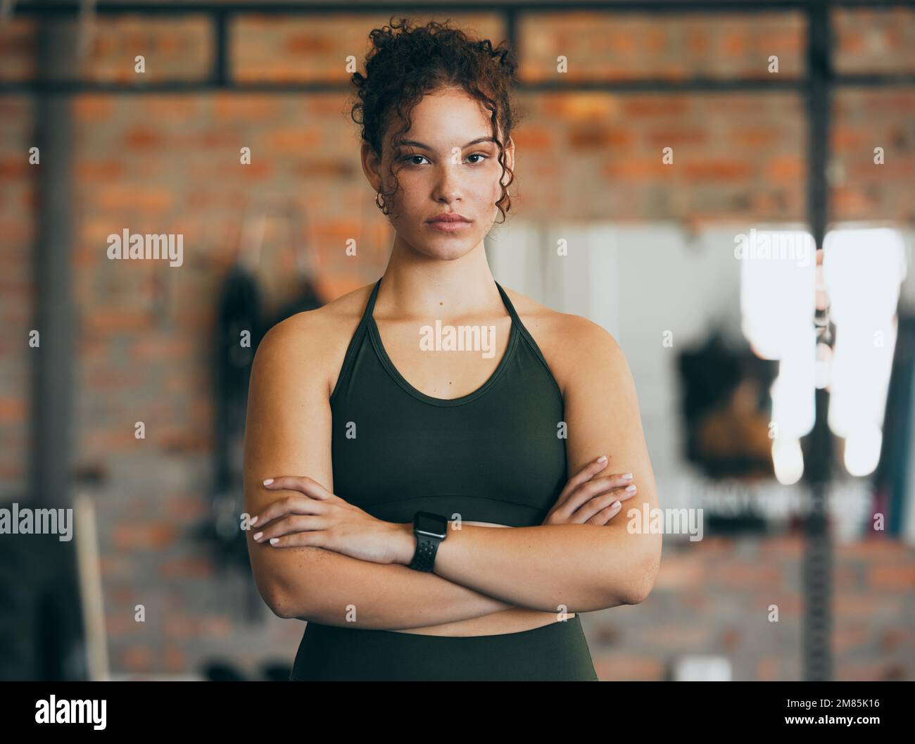 Fitness portrait, exercise and serious woman at gym for a workout ...