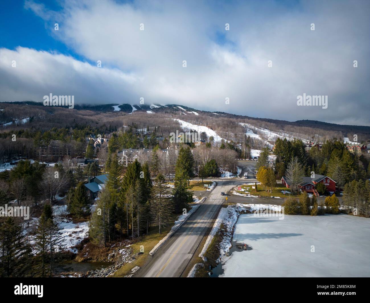 Arial view of Mount Snow ski resort mountain with clouds covering the ...