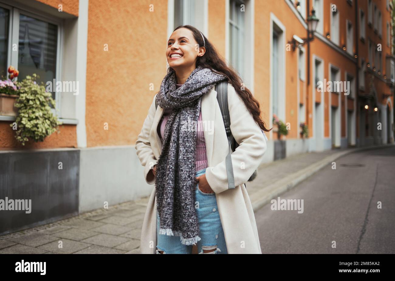 Excited, travel and walking woman in the city street for adventure ...
