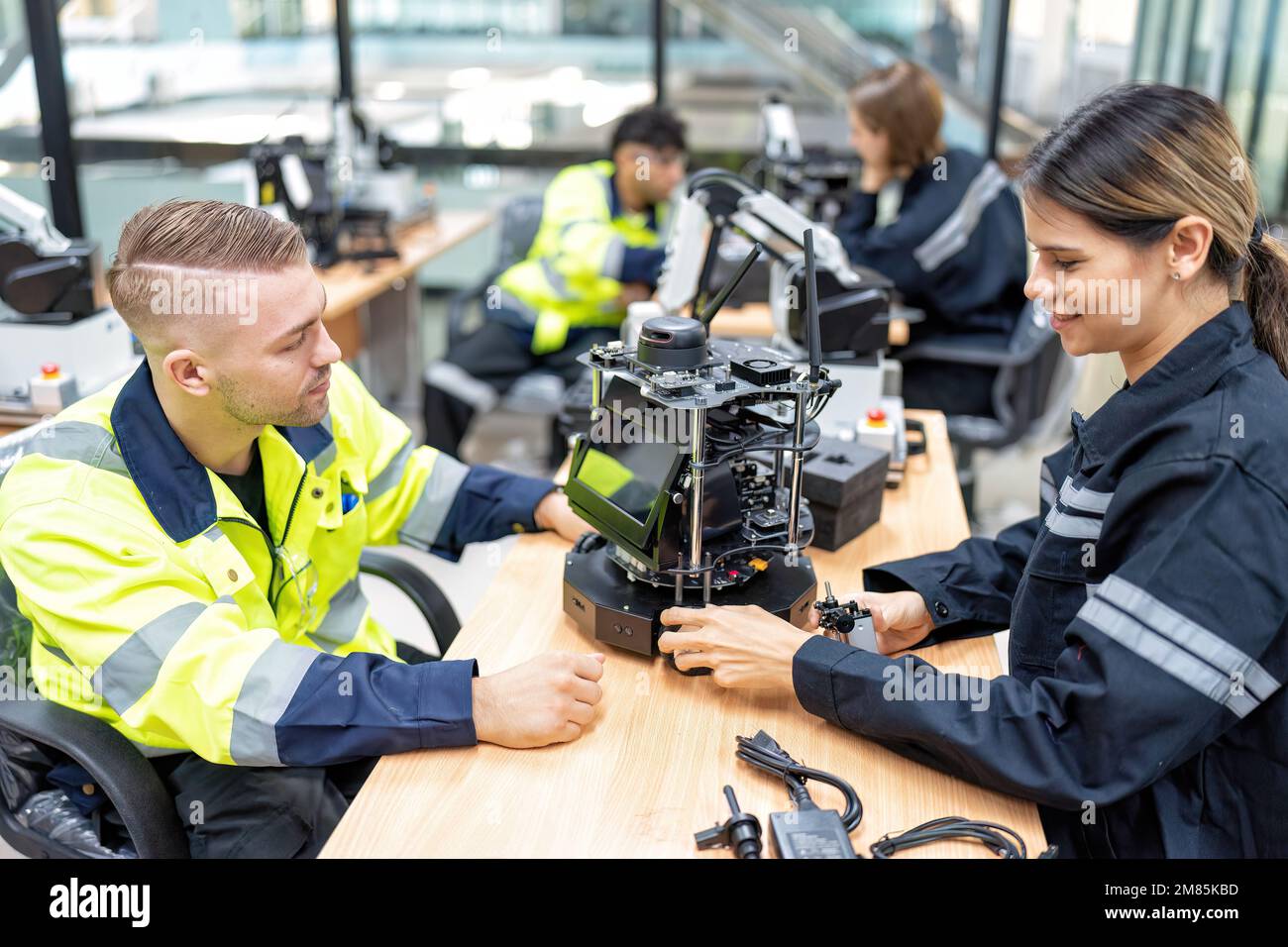 Engineer learn basic theory how to operation maintenance and programing robot arm in training ...