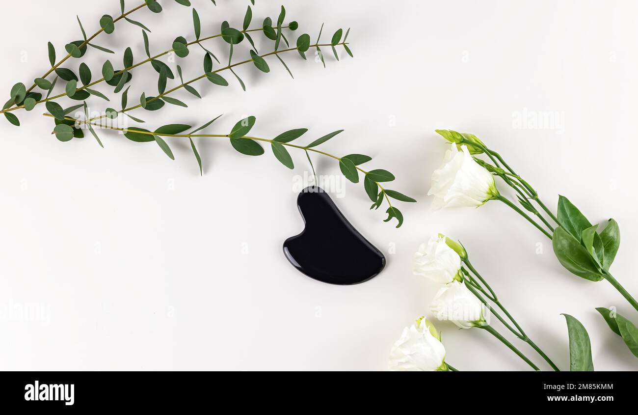 Jade gua sha for acupuncture treatment and massage Stock Photo - Alamy