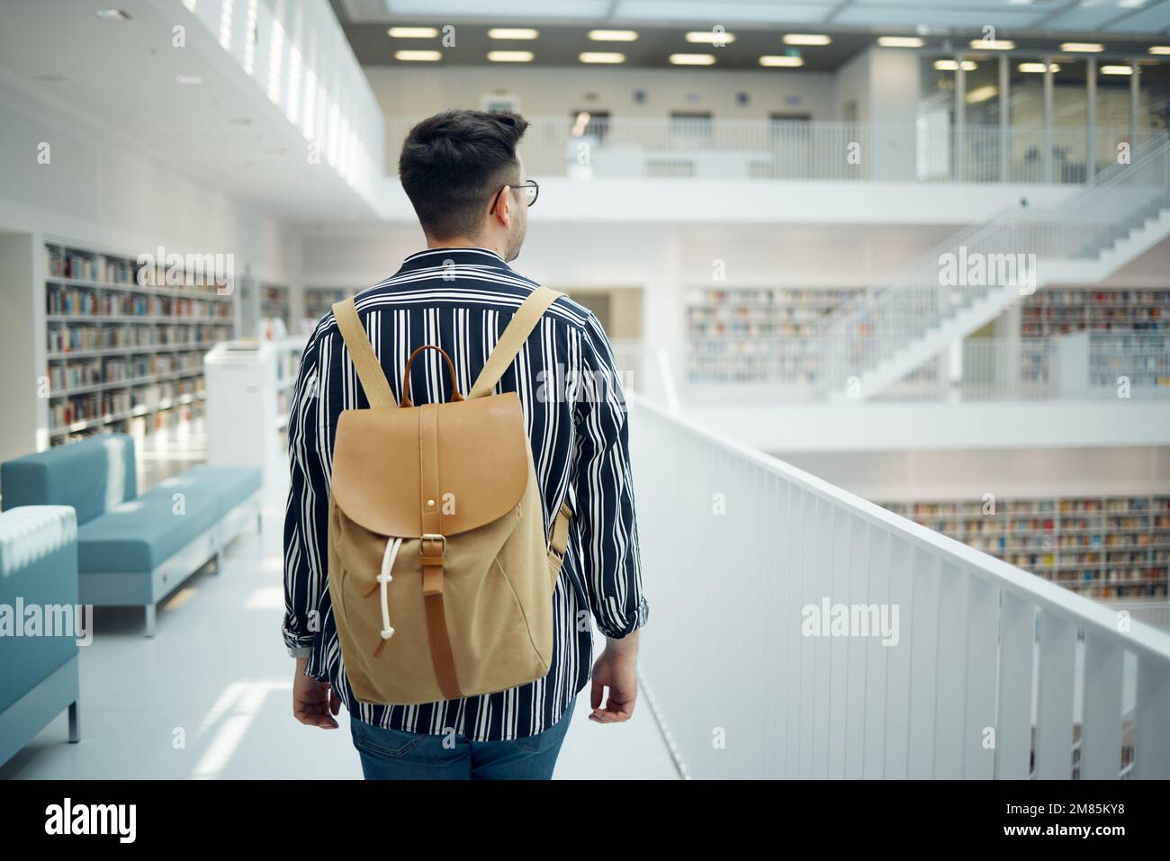 Students walking with books behind hi-res stock photography and images ...