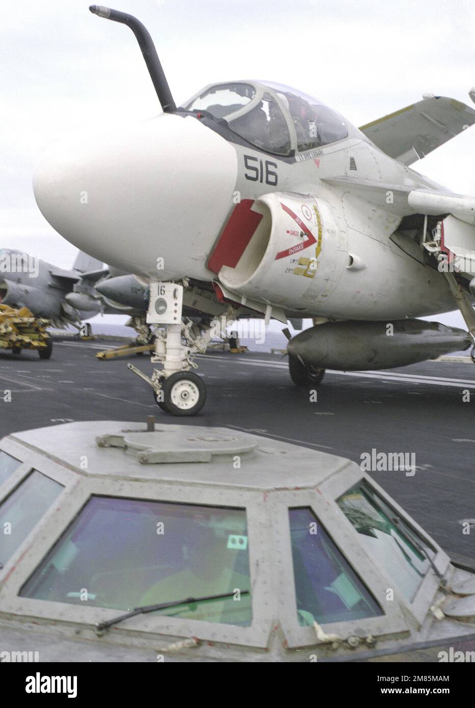 An A-6 Intruder aircraft taxis on the flight deck during flight ...