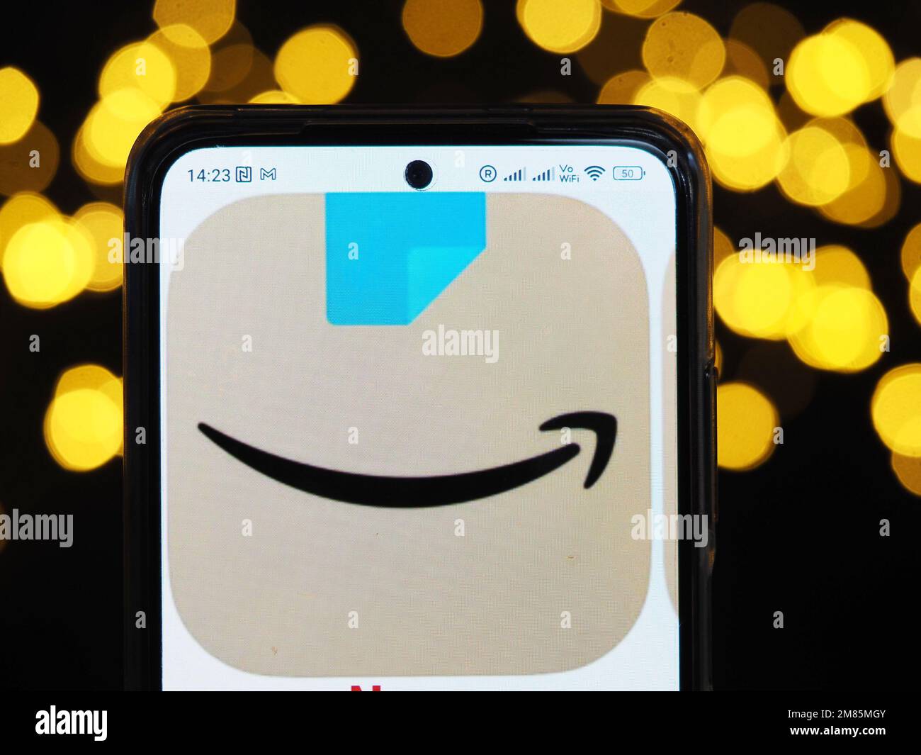 In this photo illustration, the Amazon shopping logo is displayed on a ...