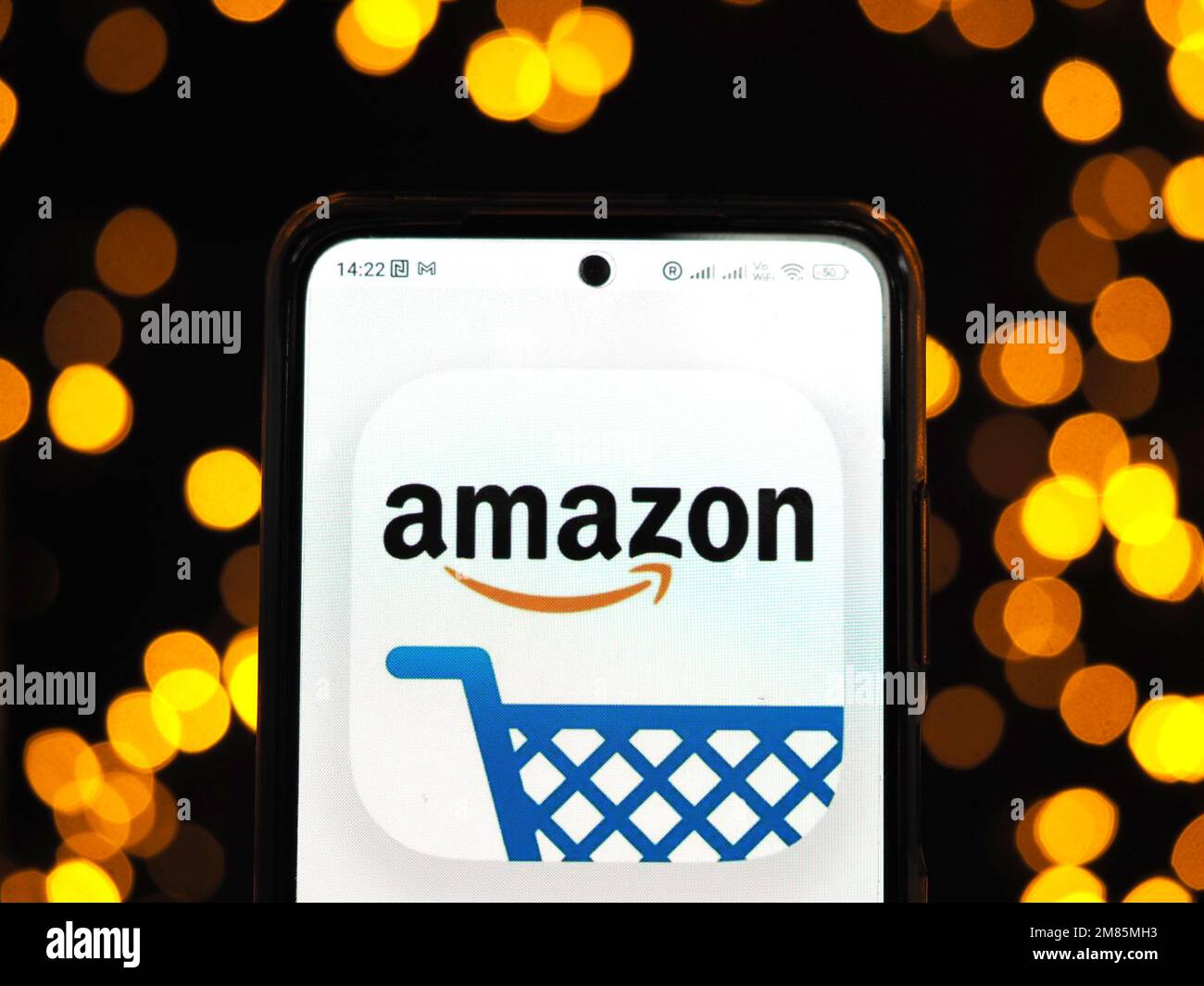 In this photo illustration, the Amazon shopping logo is displayed on a ...