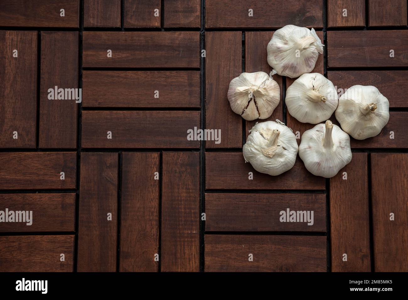 Wooden decking with garlic background. Background use eating, food ...
