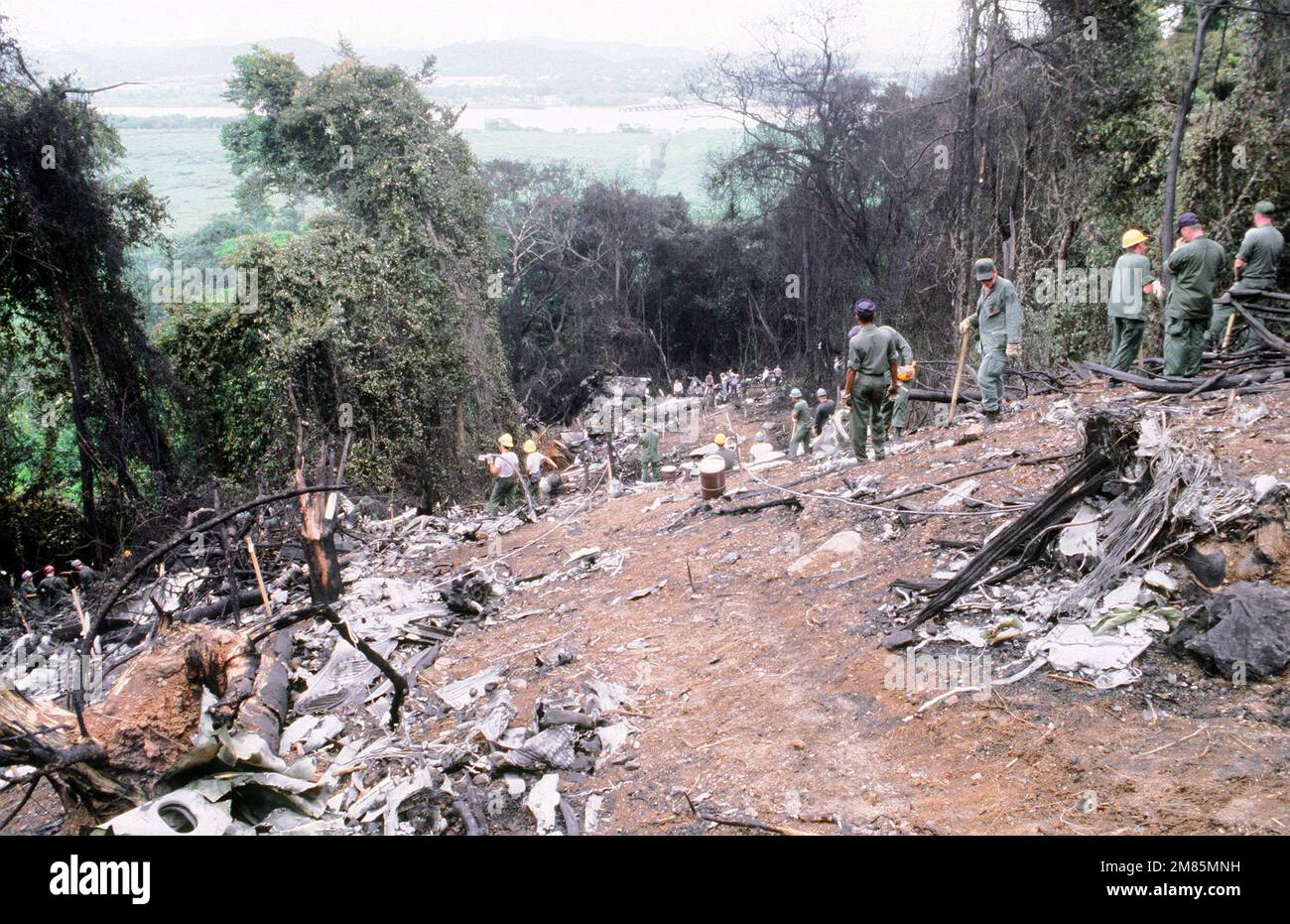 Air Force personnel sift through the wreckage of an Air Force KC-135 ...