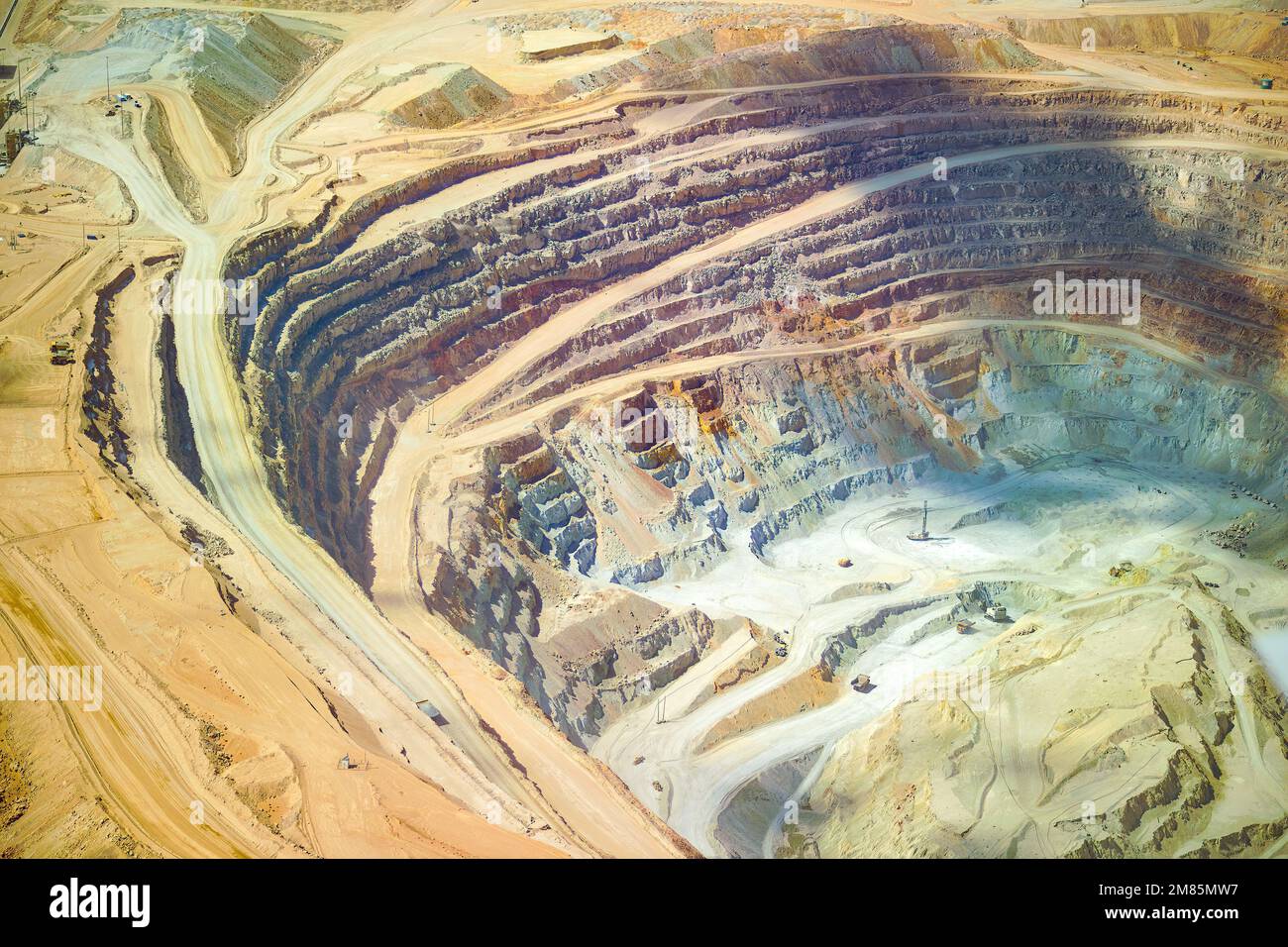 Close-up aerial view of the pit of a copper mine at the altiplano of ...