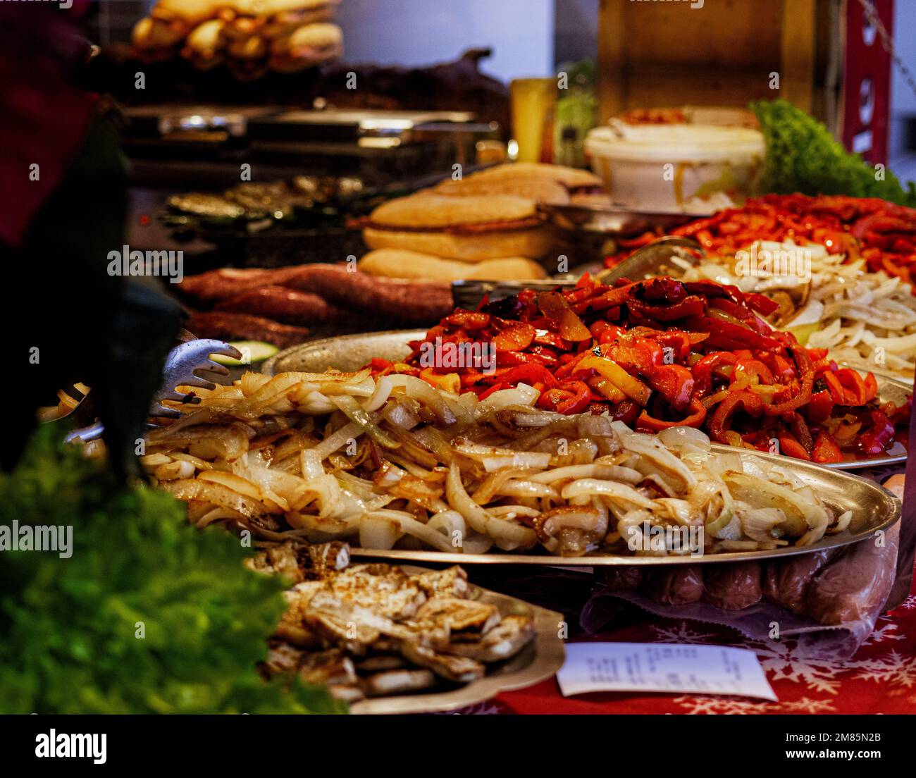 trays of grilled vegetables for the preparation of sandwiches in a ...