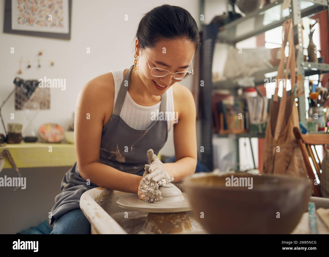 Clay, sculpture or creative woman in workshop working on an artistic ...