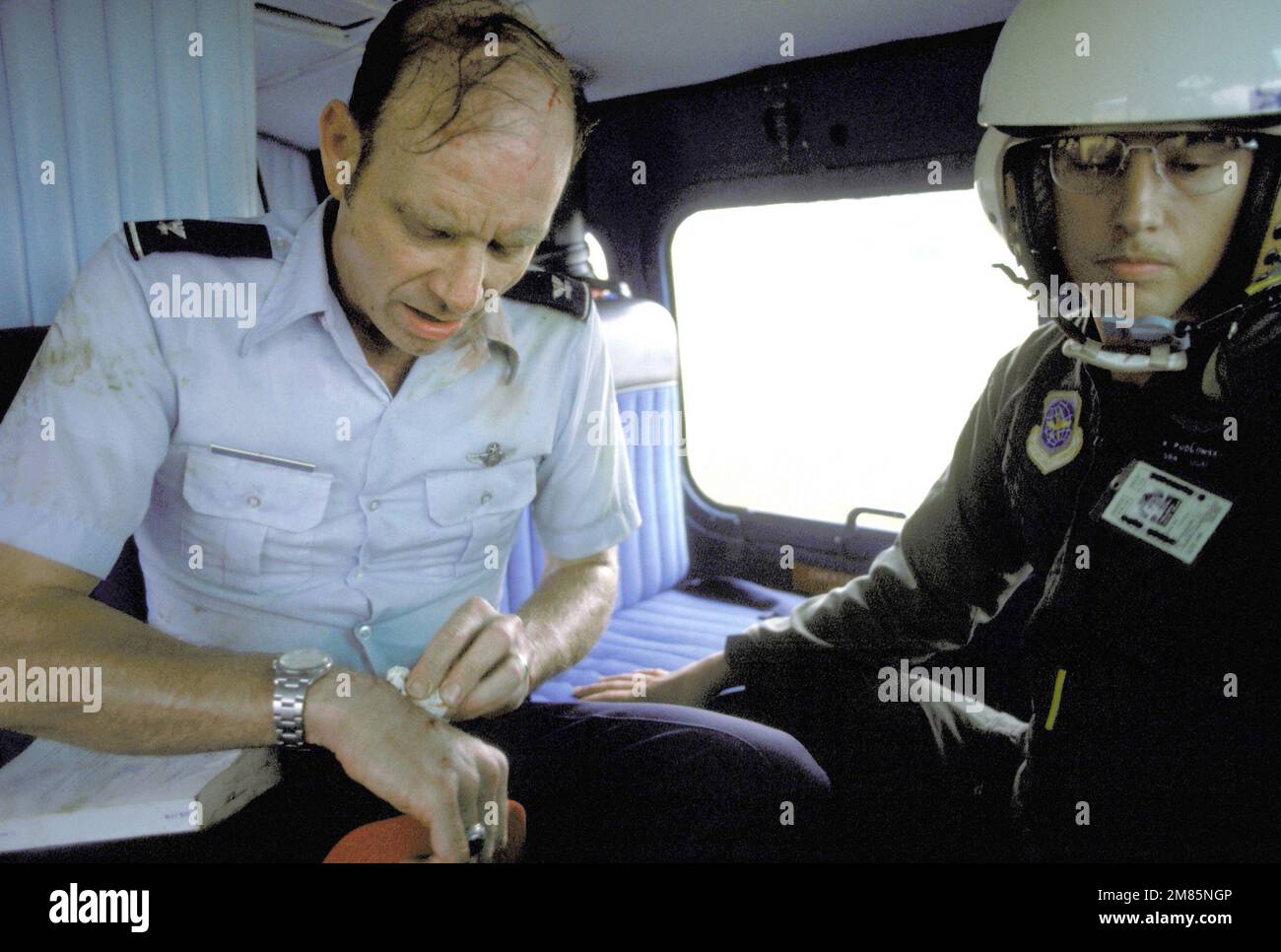 COL Edwin L. Harvey, Headquarters, Tactical Air Command, dabs blood ...