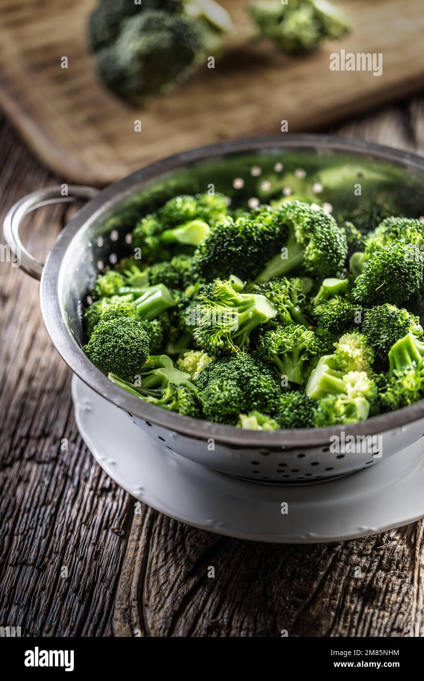 Steamed broccoli in a stainless steel steamer. Healthy vegetable ...