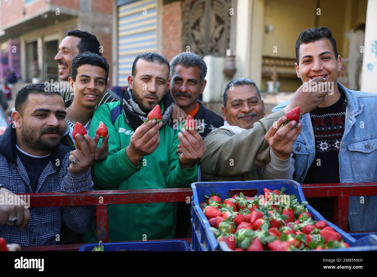 Qalyubia, Egypt. 12th Jan, 2023. People show strawberries at a market ...