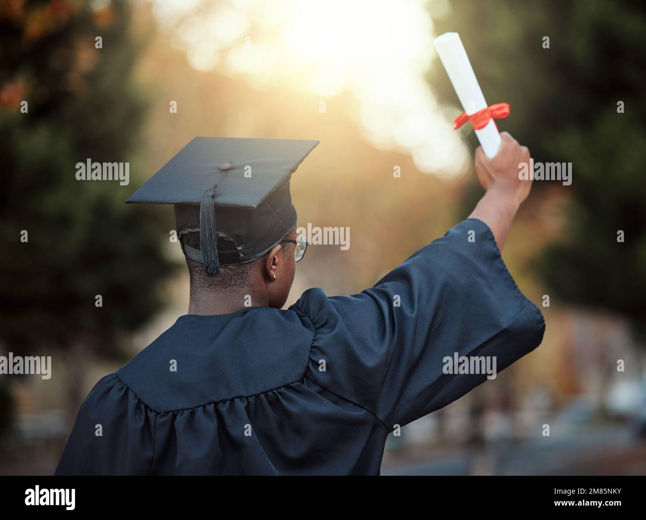 University graduation, certificate and back view of black man with ...