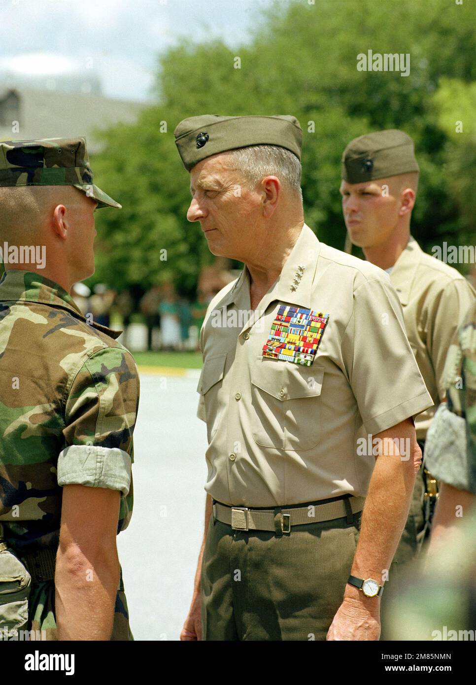GEN Robert H. Barrow inspects a Marine during an honors ceremony ...