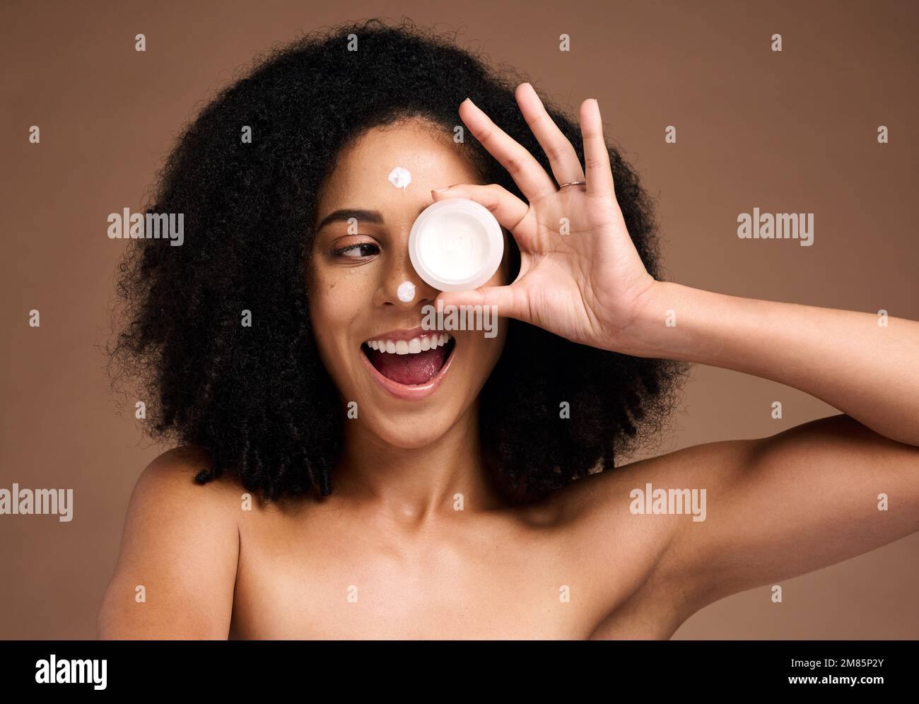 Cream container, skincare and black woman in studio happy for facial ...